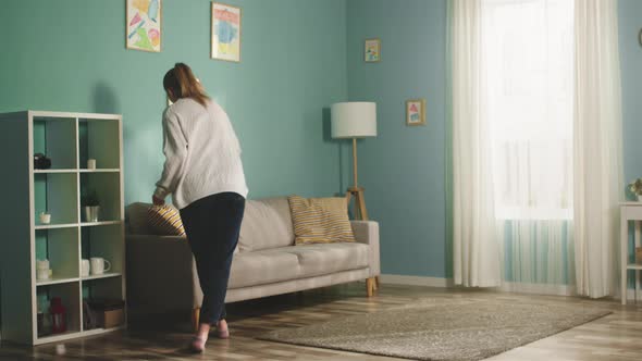 Girl finds dirty sock while cleaning and hides it, Stock Footage ...