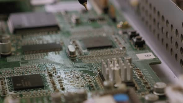 Repair of Computer Motherboard Soldering the Microchip with a Soldering ...