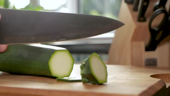 Slow motion shot slicing a courgette., Stock Footage | VideoHive