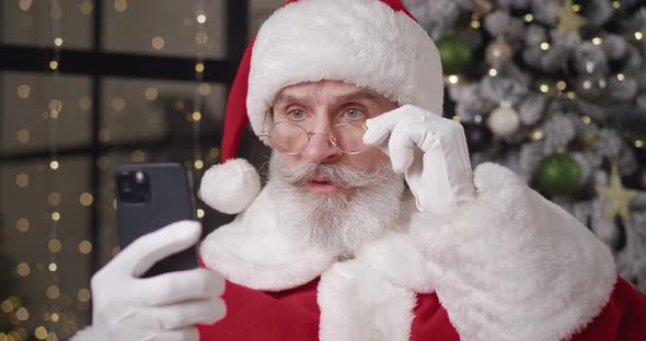 Closeup of Modern Santa Claus in His Residence Against Christmas Tree ...