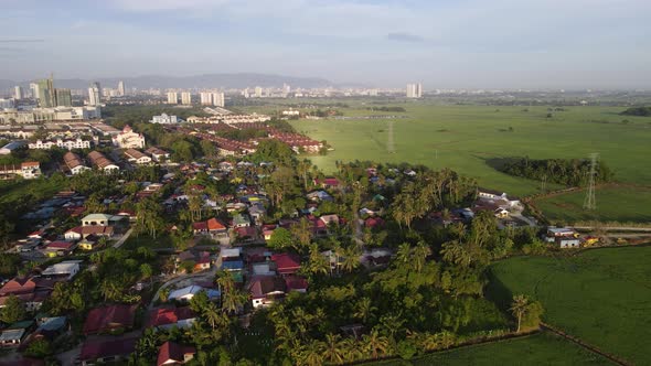 Aerial view Malays village Permatang Rawa beside paddy field, Stock Footage
