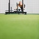 Fit young female using prowler exercise equipment at gym Stock Photo by ...