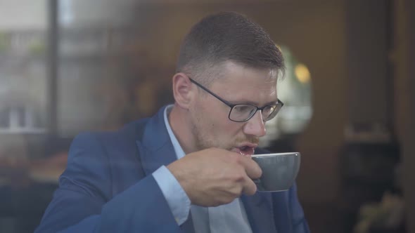 Confident Male CEO Drinking Coffee in Cafe. Portrait of Successful ...