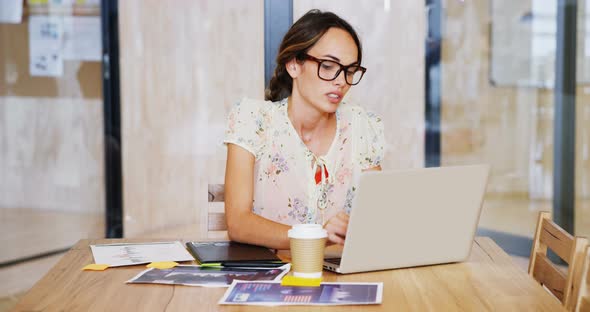 Frustrated female graphic designer using laptop, Stock Footage | VideoHive