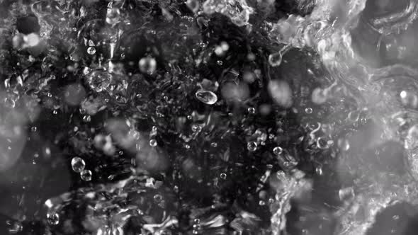 Super Slow Motion Shot of Many Water Drops Falling and Splashing on ...