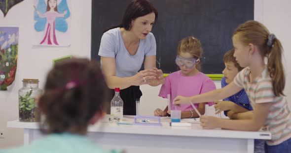 Elementary School Science Classroom Enthusiastic Teacher Explains ...