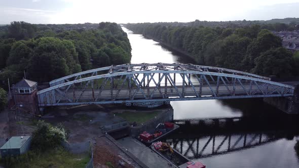 Aerial descending view Manchester ship canal Victorian swing bridge ...