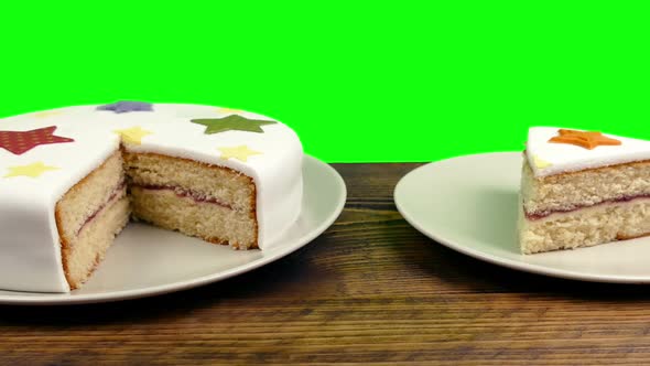 Birthday Cake And Slice Greenscreen Isolated by RockfordMedia | VideoHive