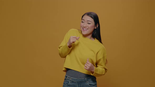 Cheerful Person Doing Celebratory Dance Moves on Camera, Stock Footage