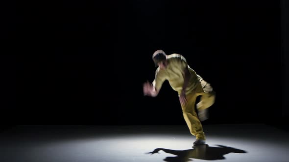 Breakdance Dancer in Yellow Suit Starts Dance on Black, Shadow, Stock ...