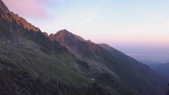 Stunning aerial panoramic view of jagged mountain peaks of Romania and ...