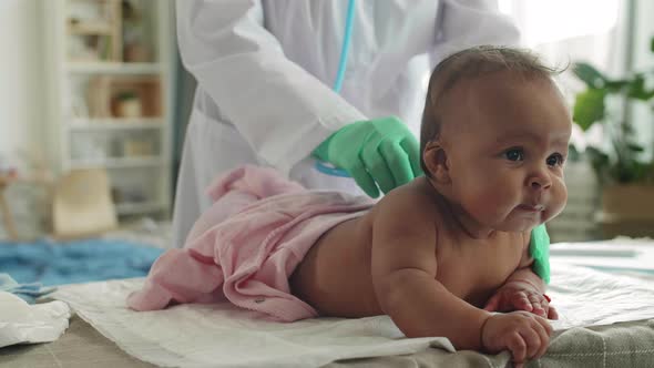 Unrecognizable Doctor Treating Infant, Stock Footage | VideoHive