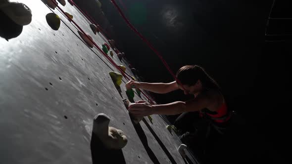 Slow Motion Female Climber Training on a Climbing Wall Practicing ...