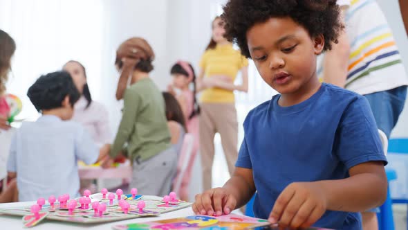 African black boy student learning a lesson in classroom with teacher ...