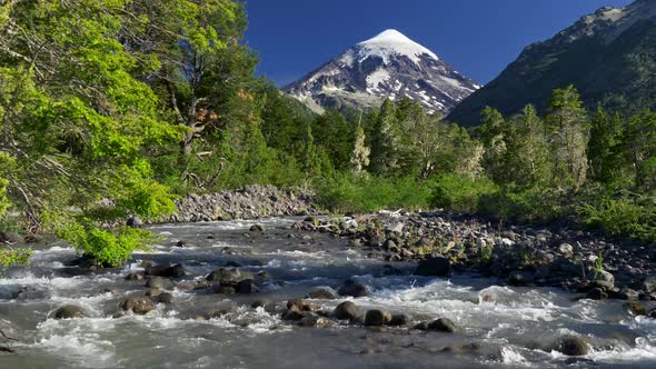 Water Flowing Through a Mountain Stream. Lanin Volcano Is Seen in the ...
