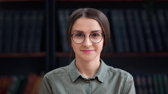 Cute Librarian Woman in Eyeglasses Smiling Posing at Bookshelves ...