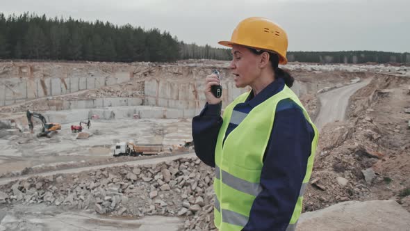 Female Quarry Supervisor Using Walkie-Talkie, Stock Footage | VideoHive