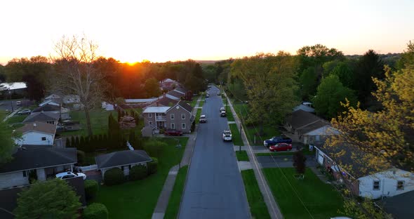 Small town neighborhood in spring. Houses in residential area at sunset ...