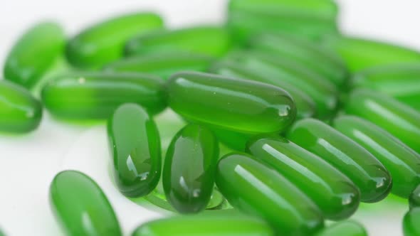 Rotating shot of green tablets, Close shot of green tablets with white ...