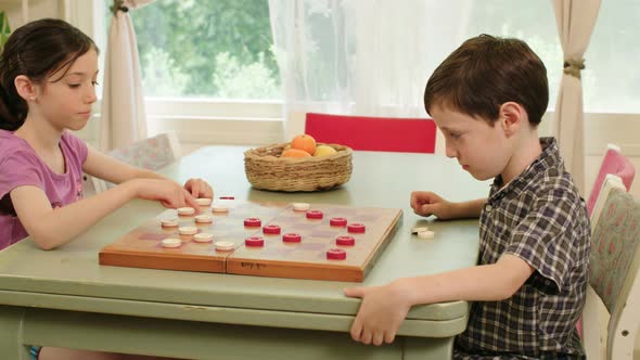 Young kids playing checkers together at home, Stock Footage | VideoHive