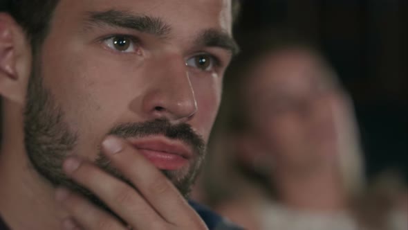 Young Pensive Man Watching Movie in Theater, Stock Footage | VideoHive