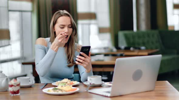 Laughing Girl Eat Appetizing Dinner Scrolling Social Network at ...