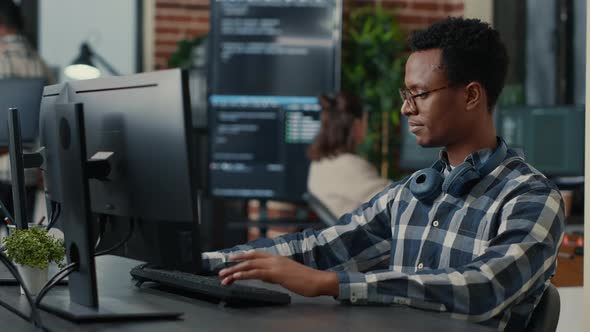 Portrait of Focused Programer Writing Code Fixing Glasses and Smiling ...