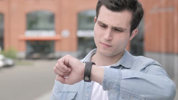 Waiting Young Man Watching Time on Watch, Stock Footage | VideoHive