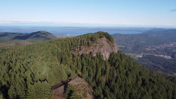 Mount Prevost, Vancouver Island. Rocky cliffs and tree-covered forest ...