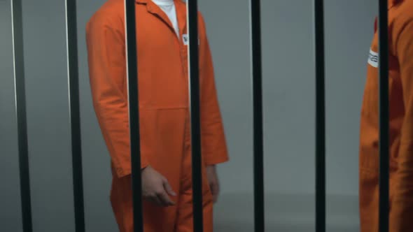 Afro-American Imprisoned Male Giving White Powder to Caucasian Inmate ...