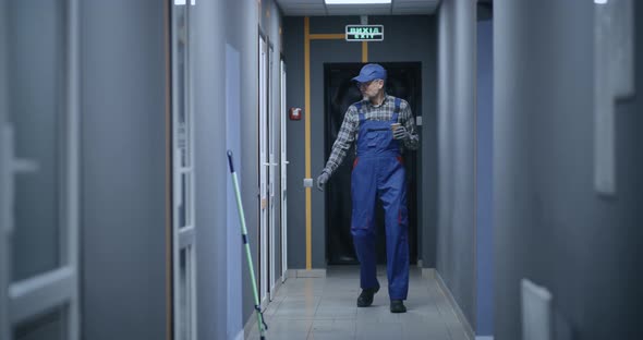 Janitor Checking Rooms in Building, Stock Footage | VideoHive
