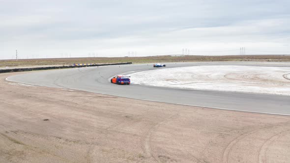 Sport Cars Training on Curved Race Track at Buttonwillow Raceway Park ...