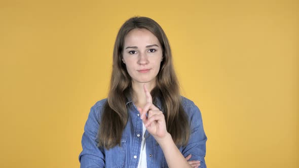 Pretty Woman Waving Finger To Refuse Isolated on Yellow Background ...