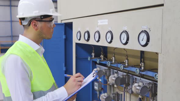 Engineer Checking Control Panel System in Manufacturing Facility ...
