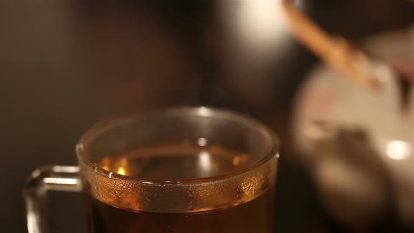 Hot Steam Vapour From Tea Cup With Teapot On Background, Stock Footage