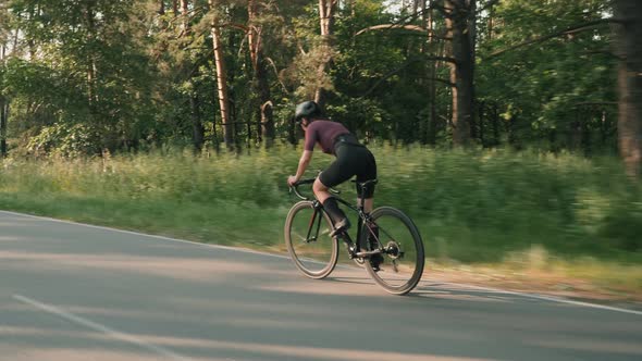 Cyclist sprinting on bicycle, hard intensively pushing pedals. Hard ...