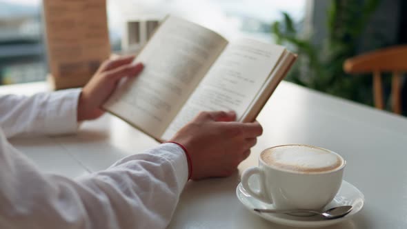 Focused Girl Reads Book Absorbed In Telling A Story Sits In A ...