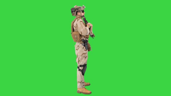 Soldier with Machine Gun Standing on a Green Screen, Chroma Key., Stock ...
