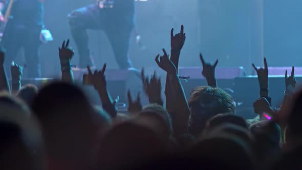 People in a Crowd Jumping To the Groove During a Rock Concert. They ...