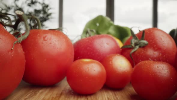 Zoom out macro video of bunch of tomatoes on the table.Shot with RED ...