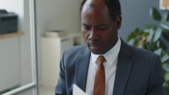 US Consular Officer Checking Documents of Visa Applicant, Stock Footage