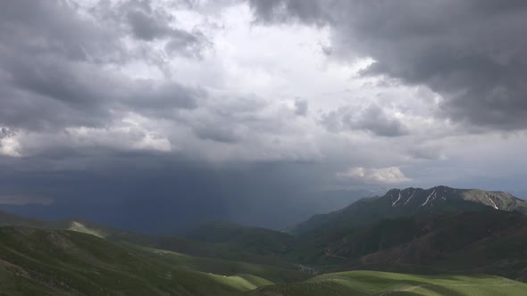 It's Raining Down Deep Valley in Mountainous Terrain, Stock Footage