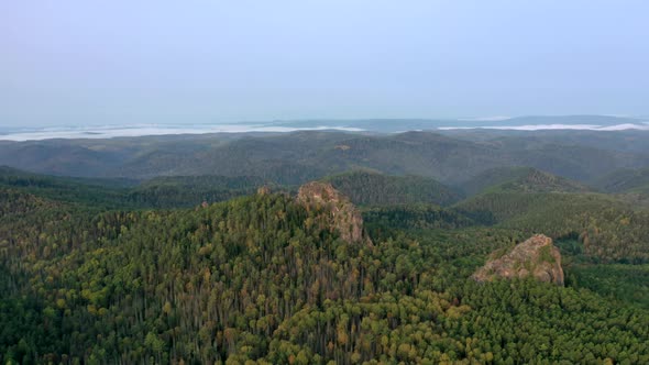 Aerial Hyperlapse of Rock Peaks in the Forest at Dawn. Stolby National ...