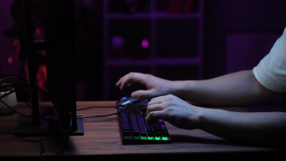 Gamer Typing on Backlight Keyboard Closeup Man Playing Video Game ...