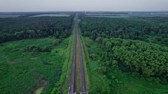 Railway Bridge in Countryside Passing Above Small River, Stock Footage