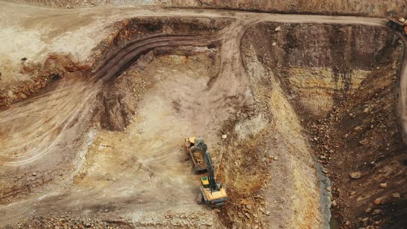 Aerial View of Volvo Excavator Loading Soil Into the Truck in the ...