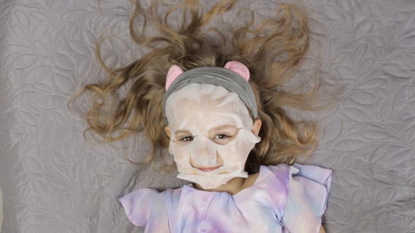 Teen Girl Applying Moisturizing Face Mask. Child Kid Take Care of Skin ...