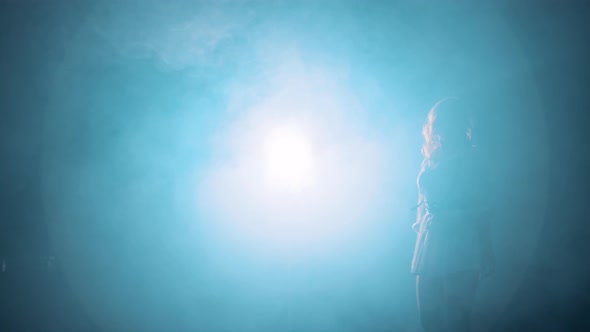 Woman dancing in the fog, Stock Footage | VideoHive