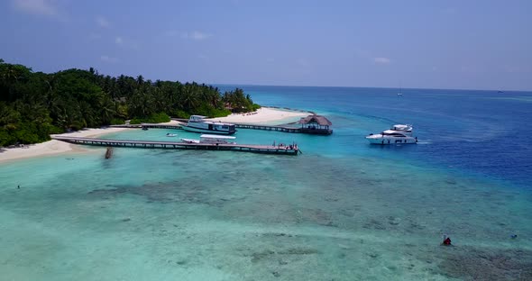 Wide angle overhead island view of a white sandy paradise beach and ...