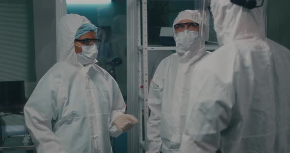 Doctors in Hazmat Suits Speaking in Clinic, Stock Footage | VideoHive